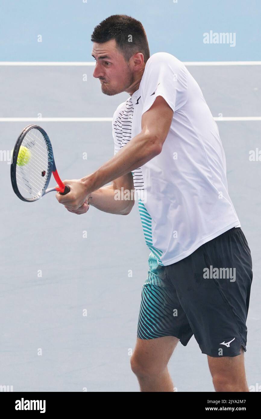 Bernard Tomic of Australia hits a backhand in his qualifying match ...
