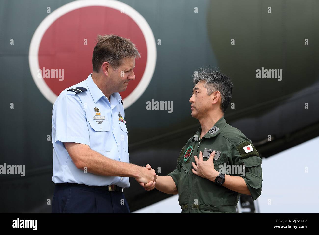 RAAF Air Commodore Carl Newman shakes hands with Japan Air Self-Defense ...