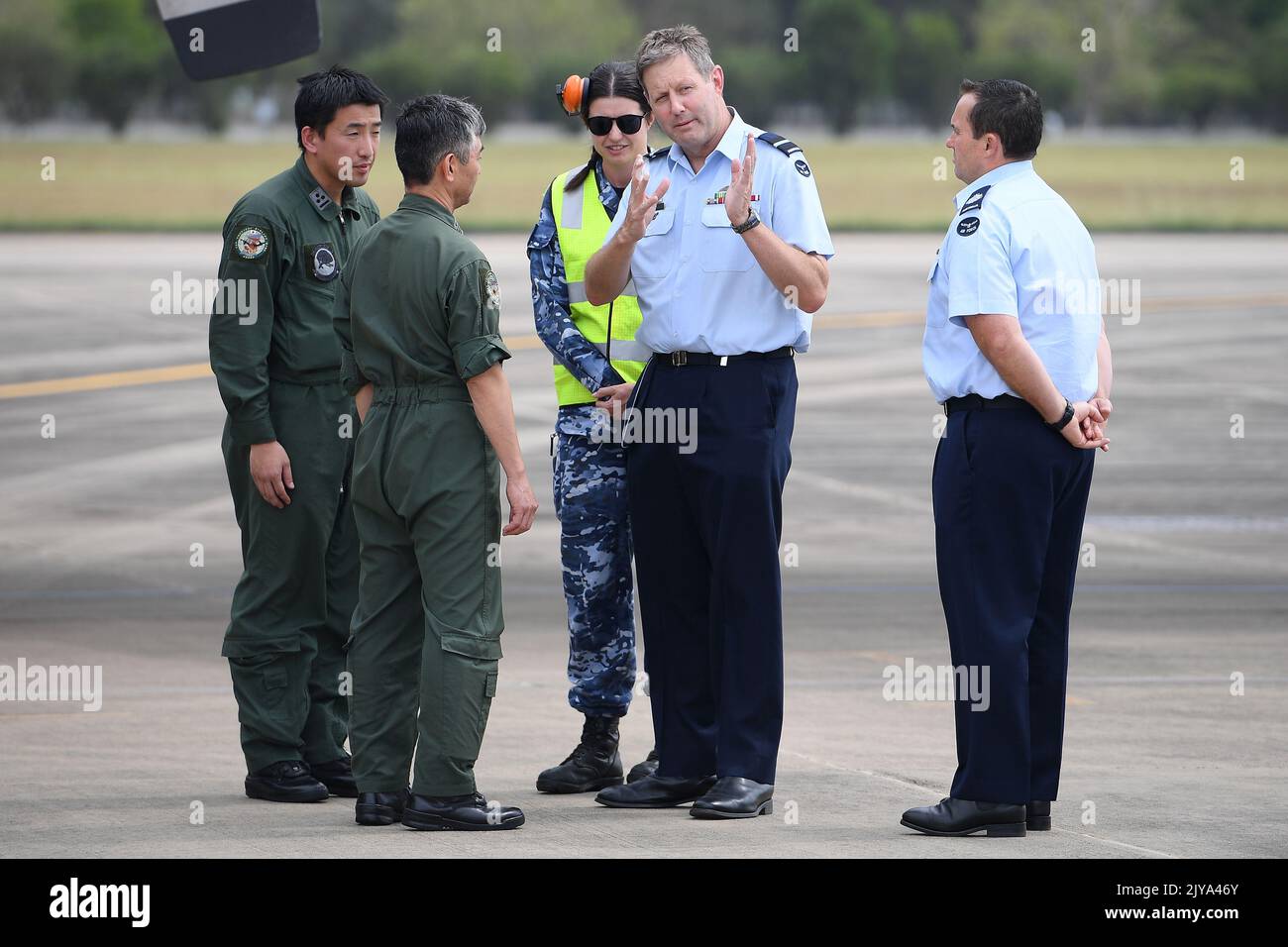 RAAF Air Commodore Carl Newman (second right) welcomes Japan Air Self ...
