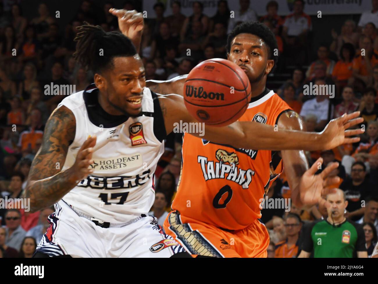 Adelaide's Eric Griffin (left) battles Taipans' Cameron Oliver (right ...