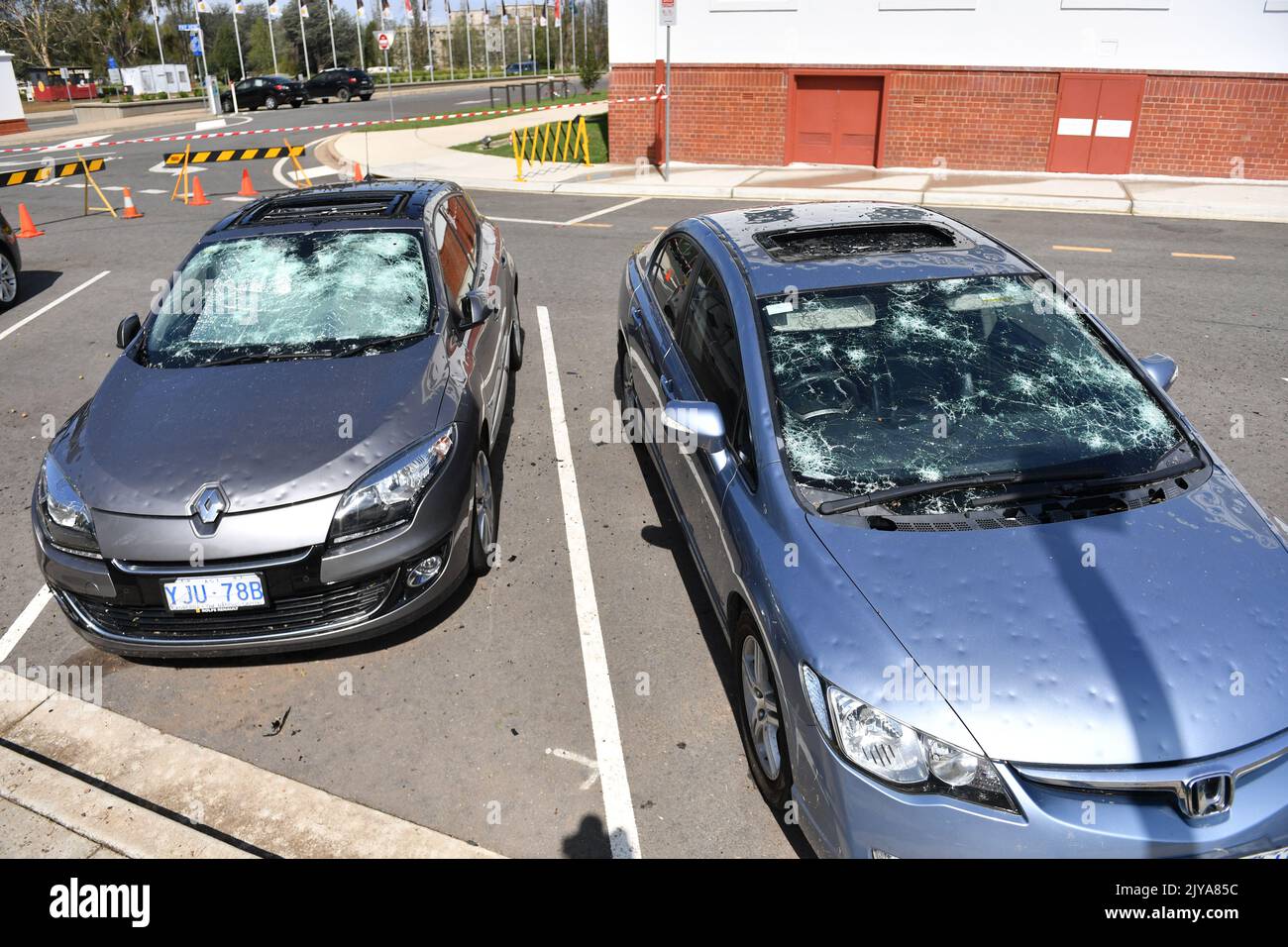 Hail damaged cars are seen parked outside Old Parliament House in ...