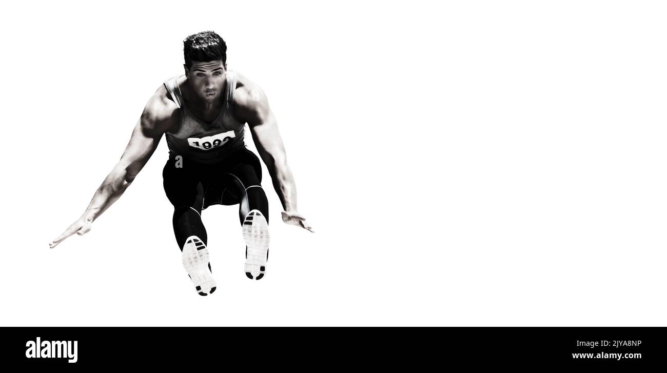 Full length of focused sportsman long jumping against white background ...