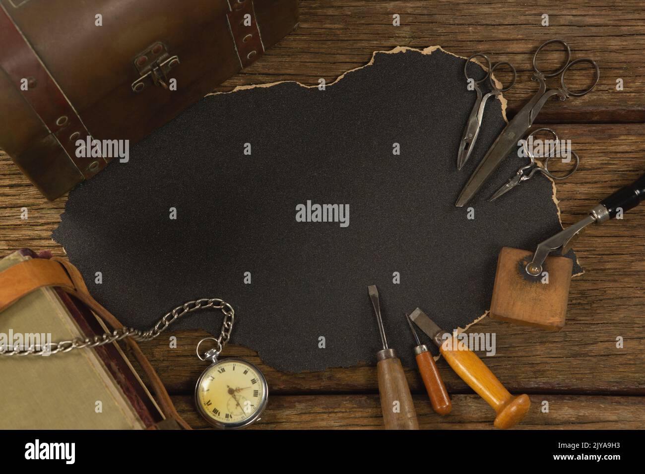 Paper piece with tools on table, Close-up Stock Photo - Alamy