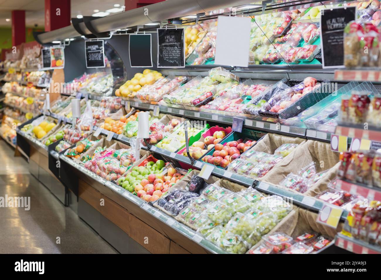 Various fruits arranged in grocery store Stock Photo - Alamy