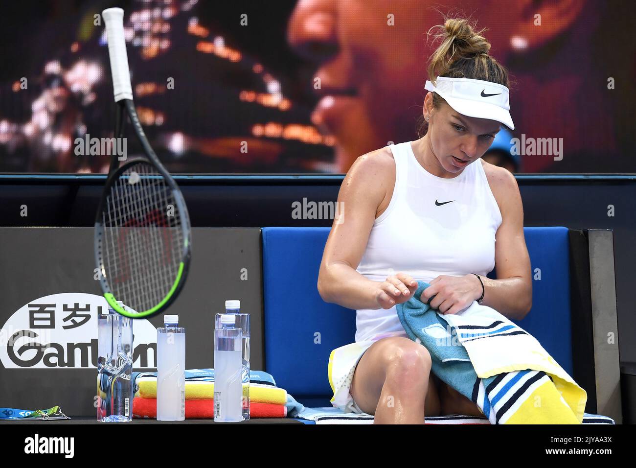 Simona Halep of Romania throws her racquet during her first round match ...
