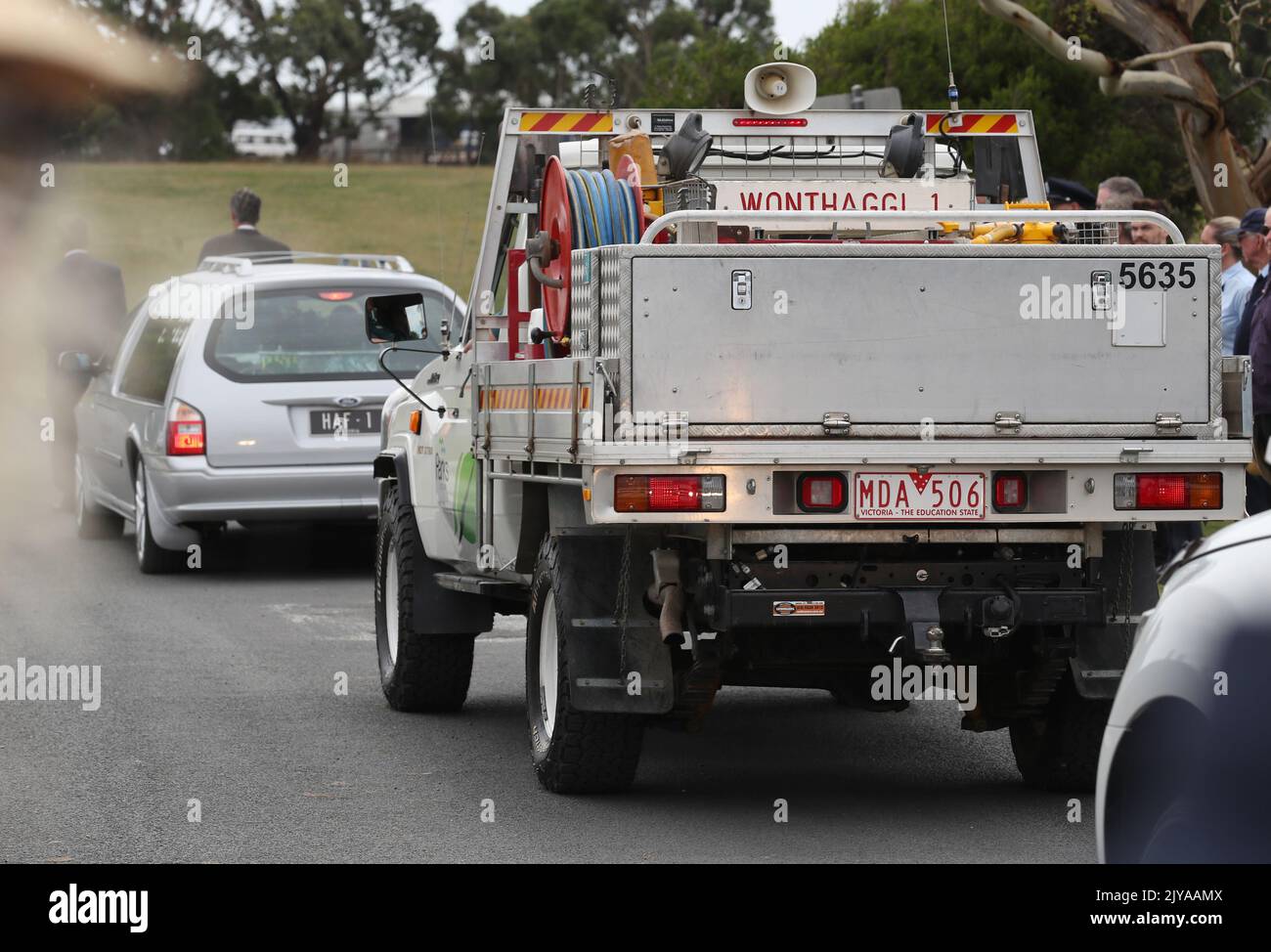 A fire truck follows the hearse after the funeral for veteran ...