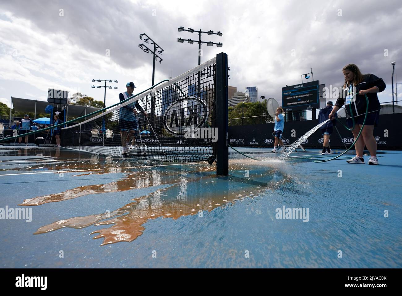 Outside courts are seen being cleaned after a rain delay on day four of ...
