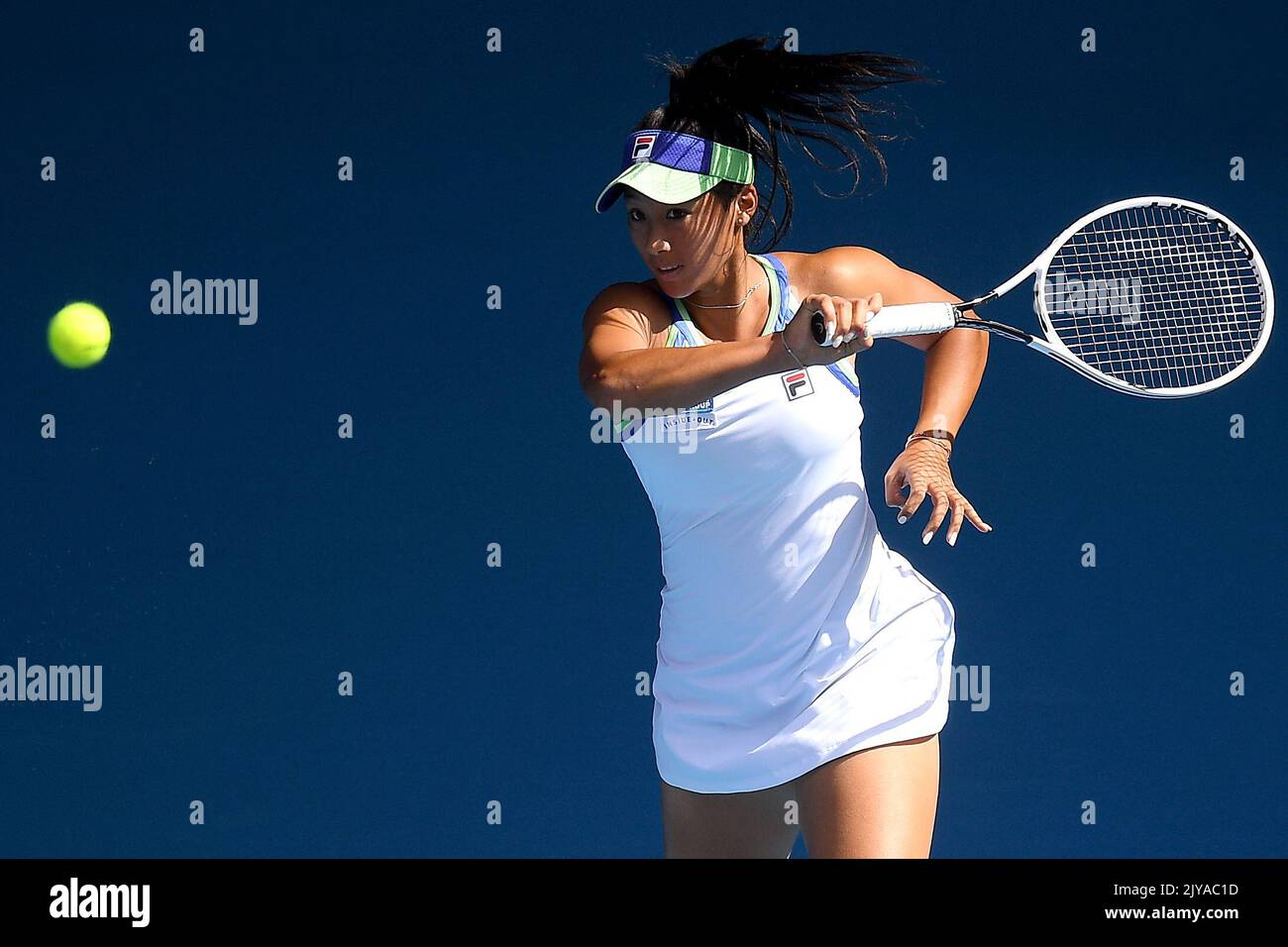 Priscilla Hon of Australia returns a shot during her second round match ...