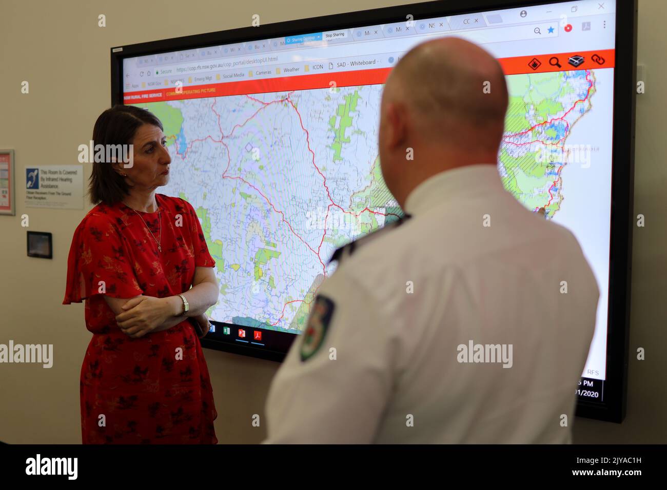 RFS Commissioner Shane Fitzsimmons shows NSW Premier Gladys Berejiklian ...