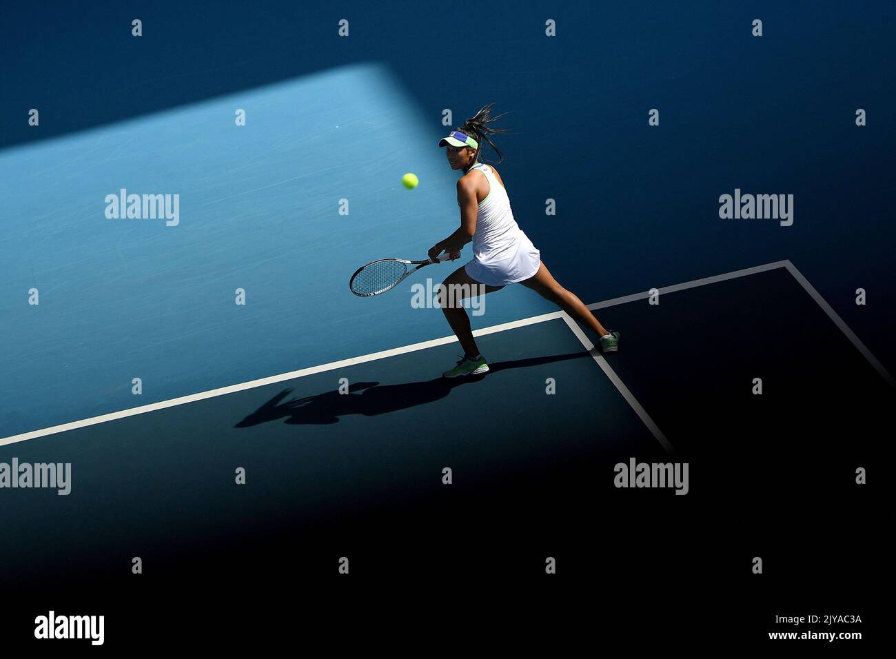 Priscilla Hon of Australia returns a shot during her second round match ...