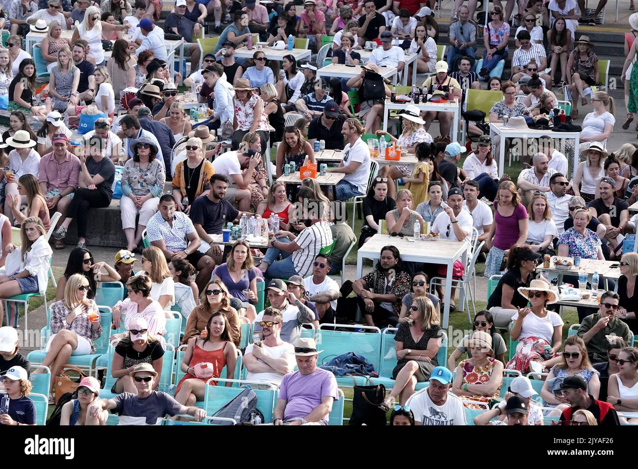 Spectators watch the big screen at Garden Square on day six of the ...