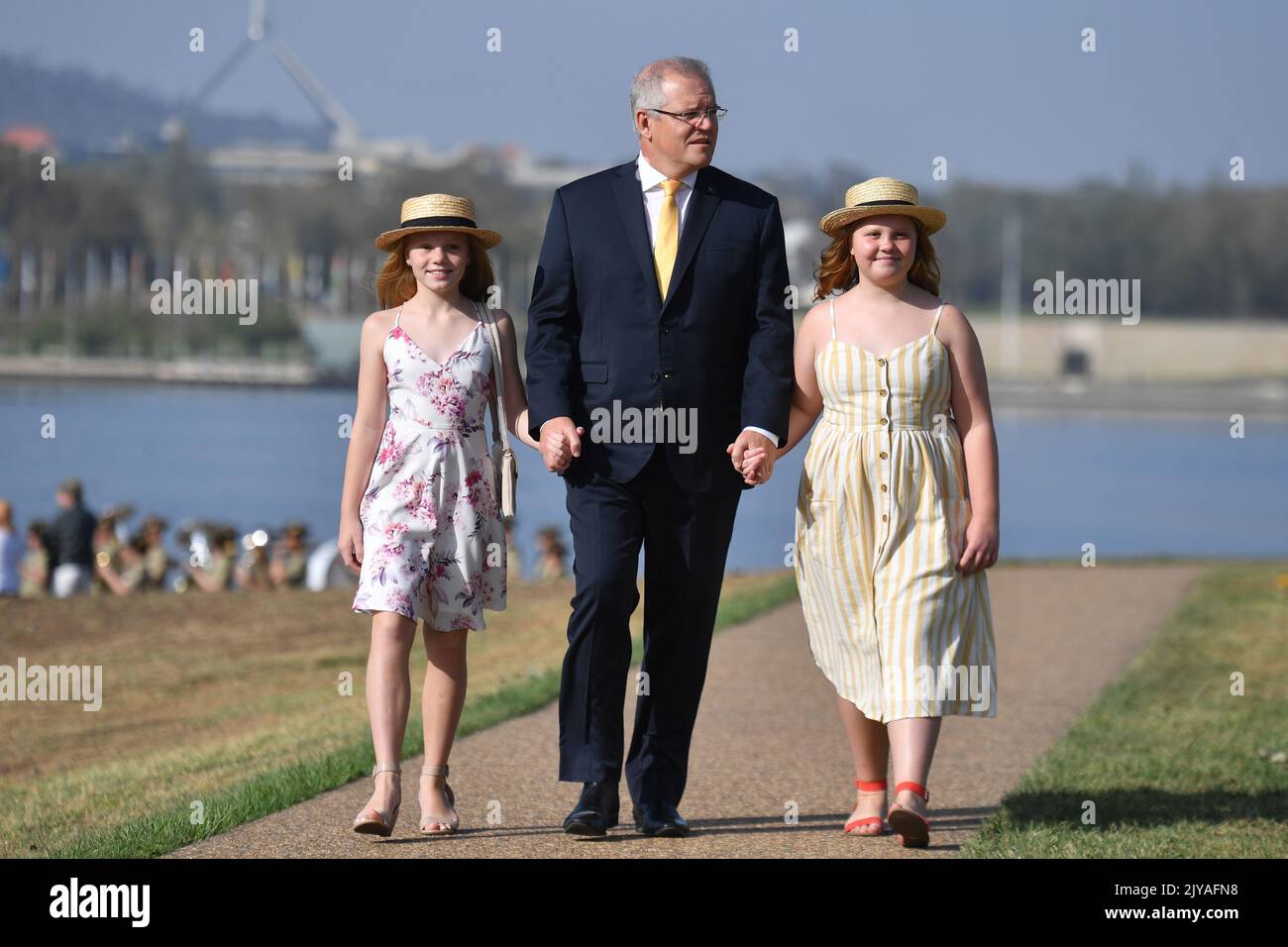 Prime Minister Scott Morrison and daughters Abbey and Lily arrive at an ...