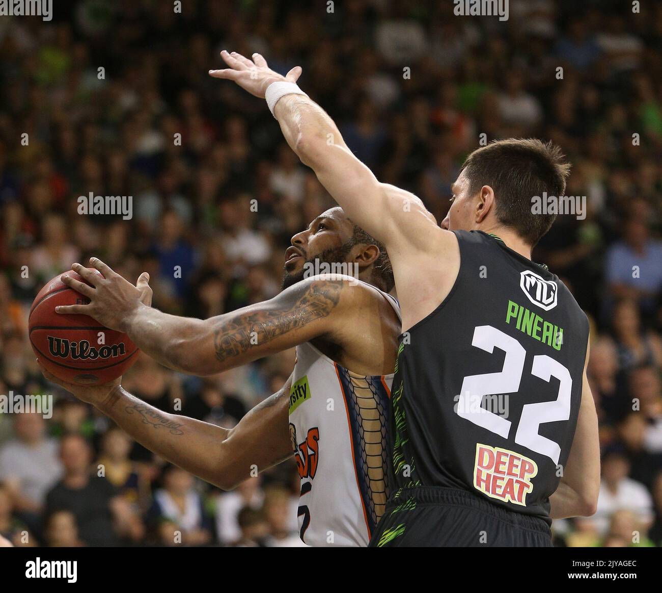 DJ Newbill of Cairns (left) contests with Dane Pineau of the Phoenix ...