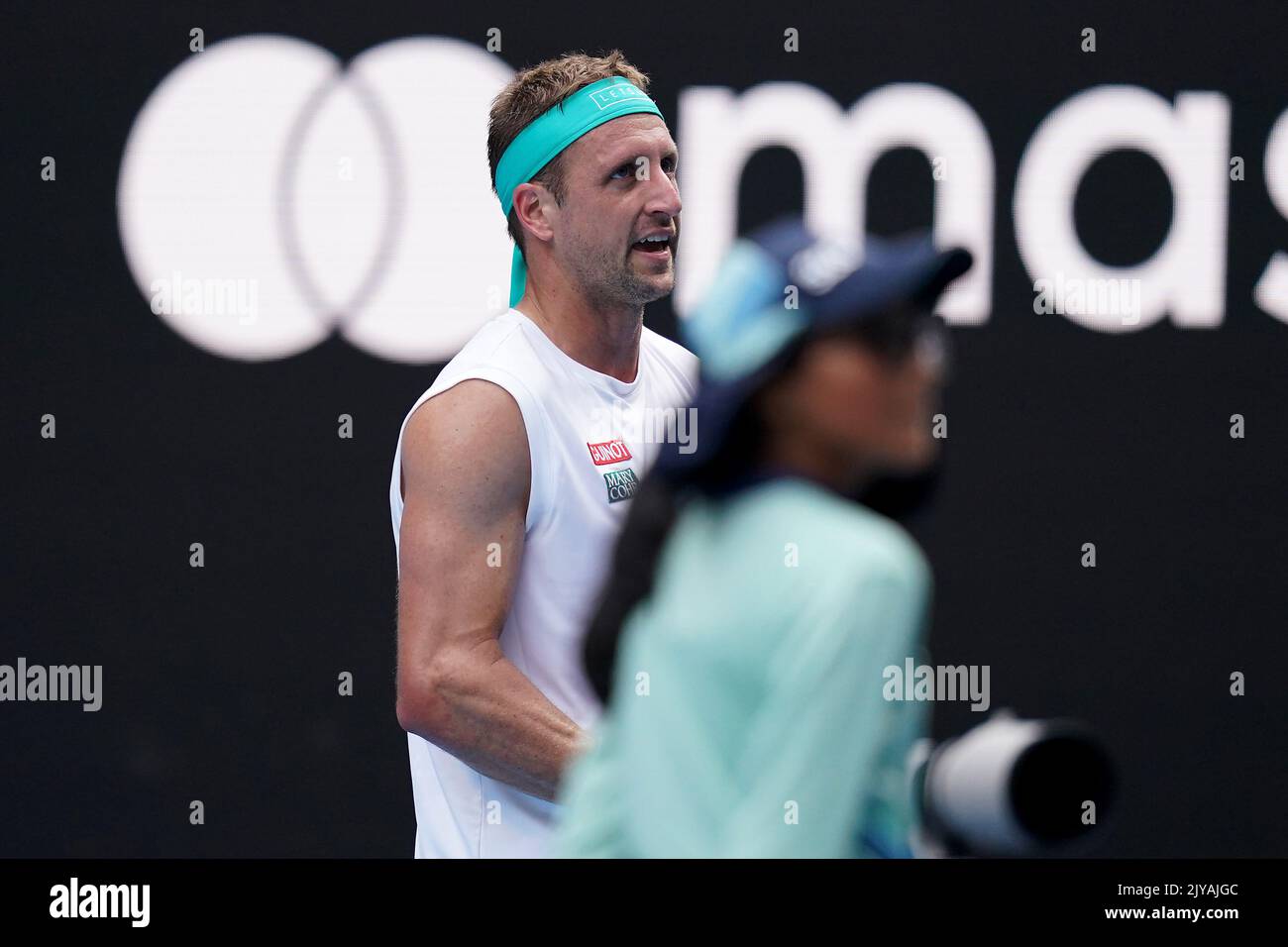 Tennys Sandgren of the USAreacts after running into a ballkid during ...