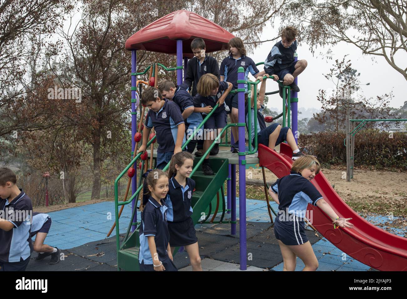 Students play in the playground on the first day of school in Cobargo ...