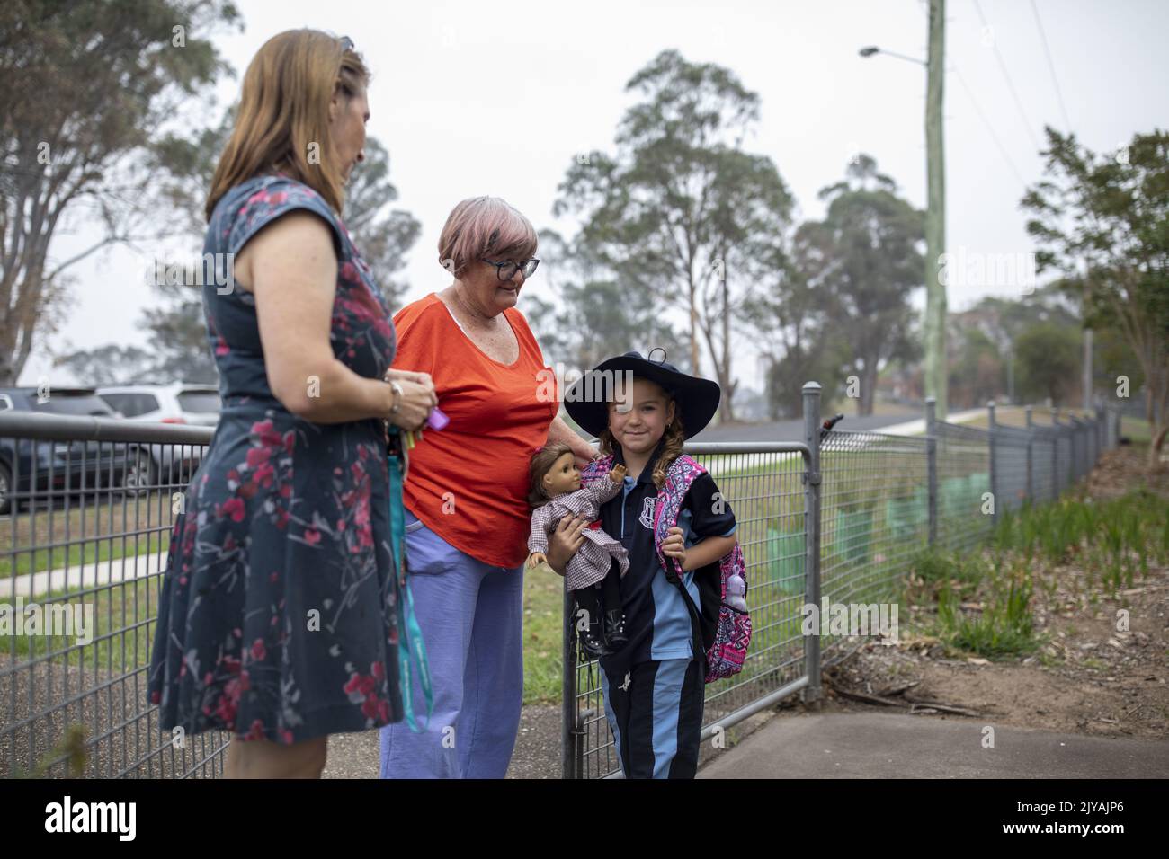 Year 2 student Sarah is welcomed back to school by principal Gillian ...