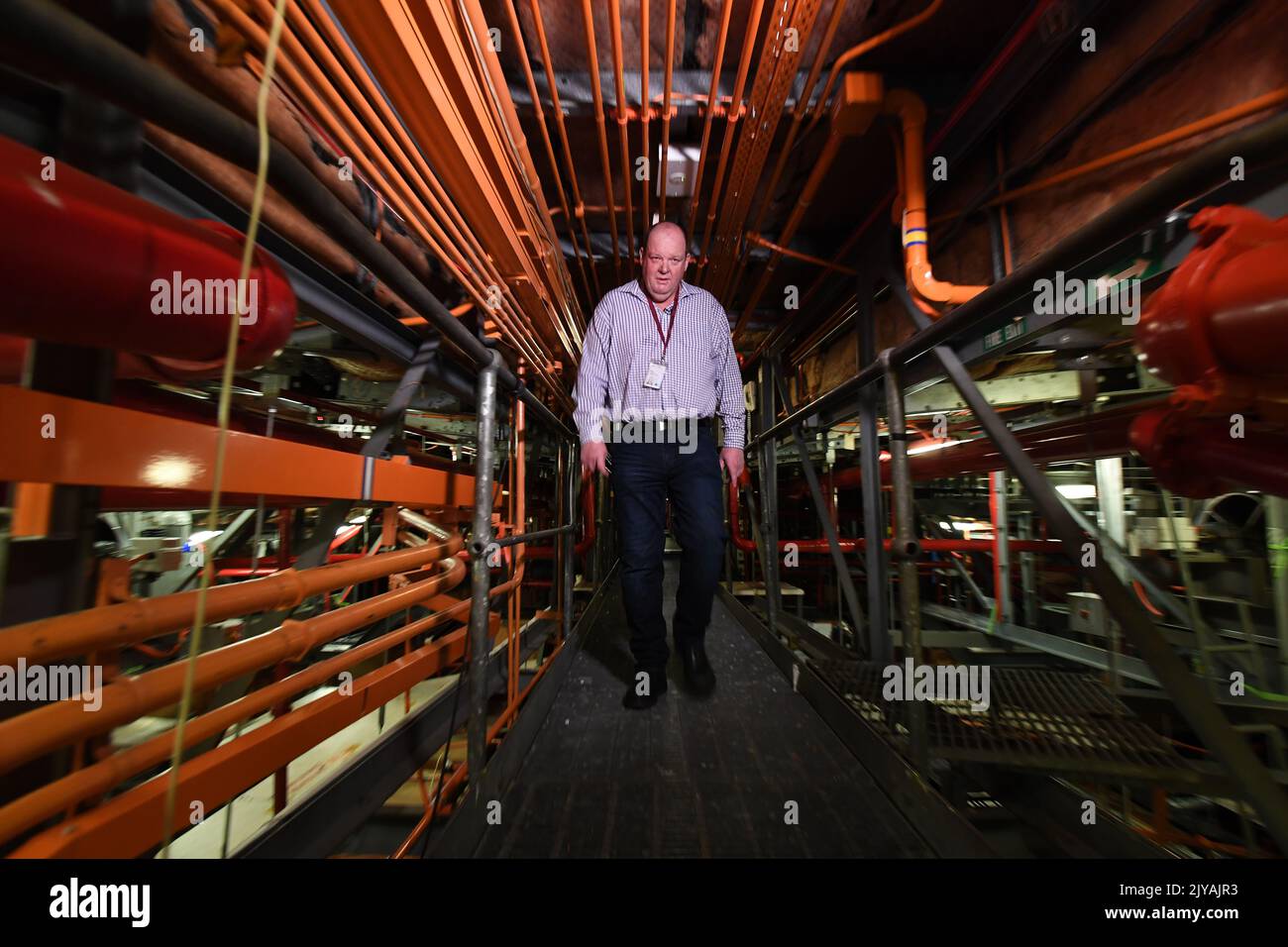 Sydney Opera House Technical Manager Philby Lewis walks along the roof ...
