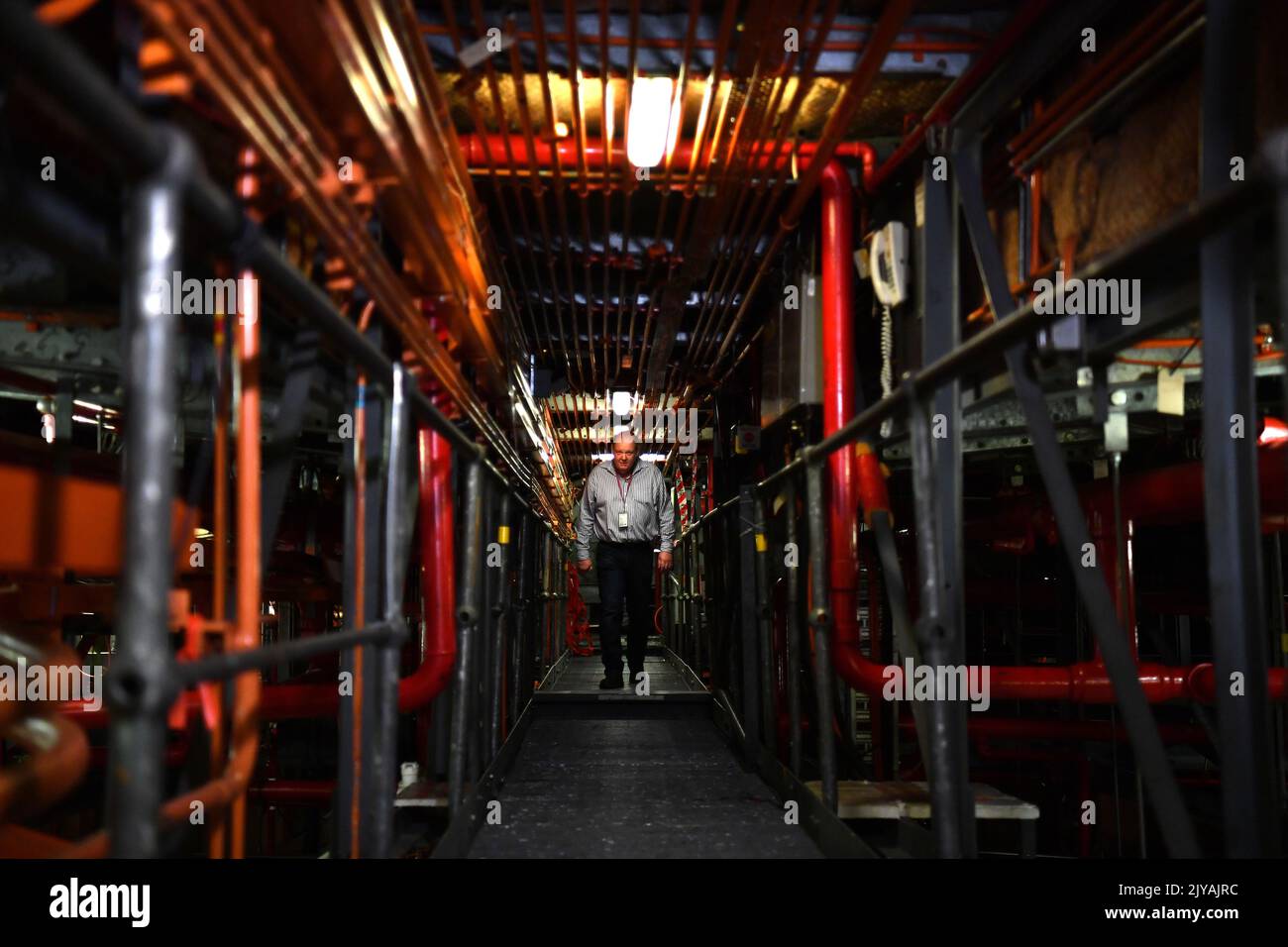 Sydney Opera House Technical Manager Philby Lewis walks along the roof ...