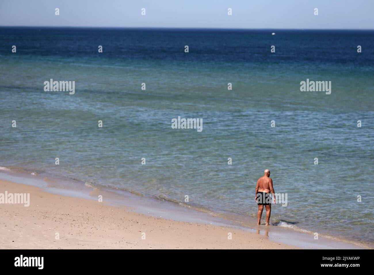 Beachgoers are seen at Glenelg beach in Adelaide, Thursday, January 30 ...