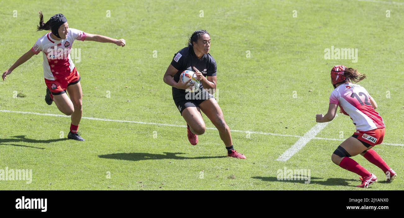 Alena Saili of New Zealand is tackled by Japanese women during day one ...
