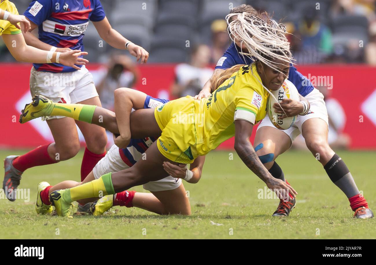 Ellia Green of Australia is tackled during day two of the Sydney 7S ...