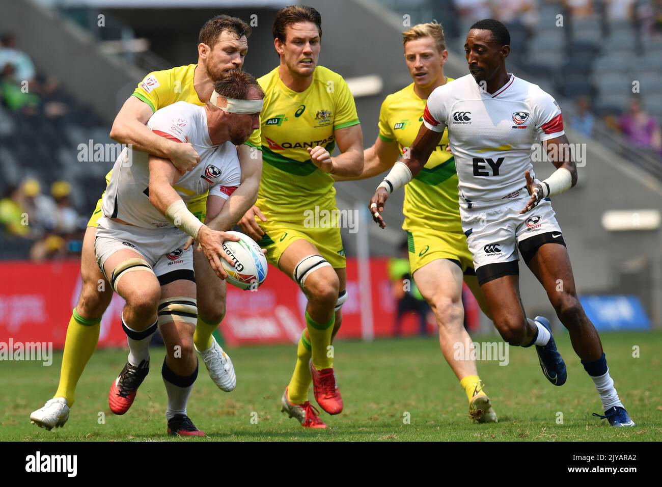 Ben Pinkelman of the USA off loads to Perry Baker of the USA during day ...