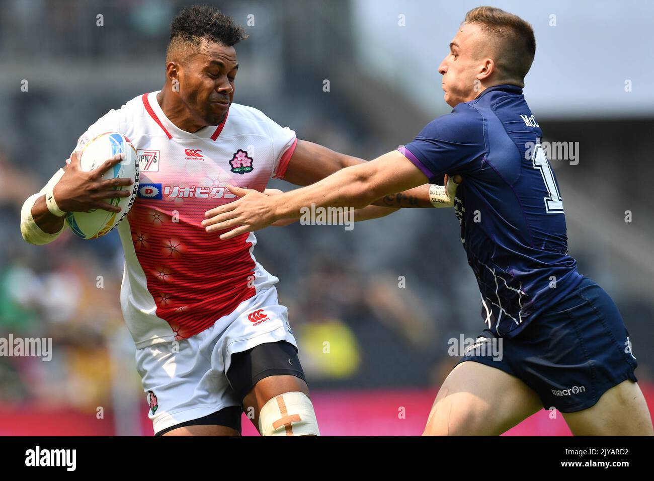 Jose Seru of Japan tires to fend off Ross McCann of Scotland during day ...