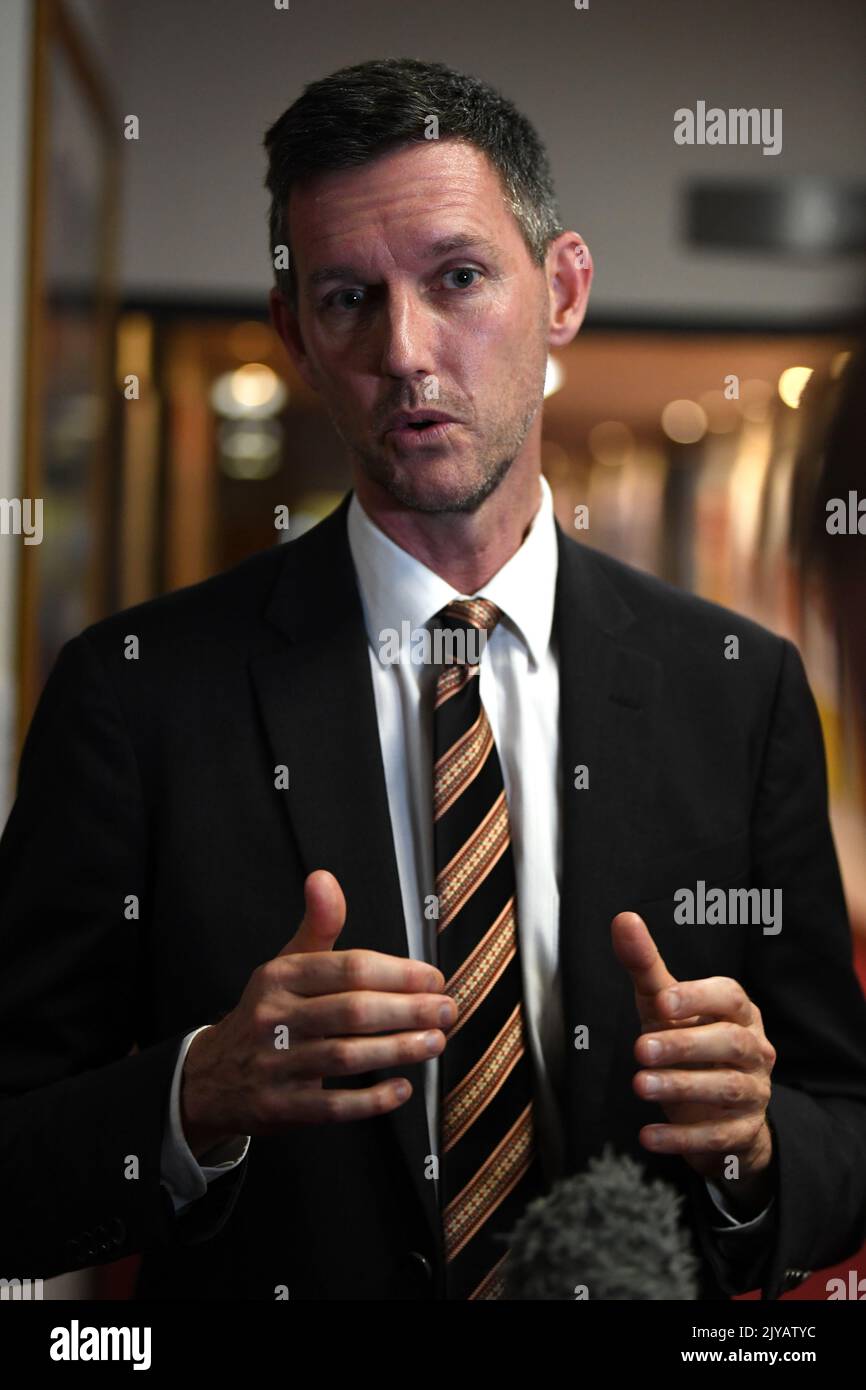 Queensland Transport Minister Mark Bailey speaks to the media on the ...