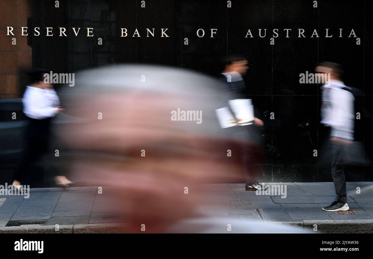 Pedestrians walk past the Reserve Bank of Australia (RBA) building in ...