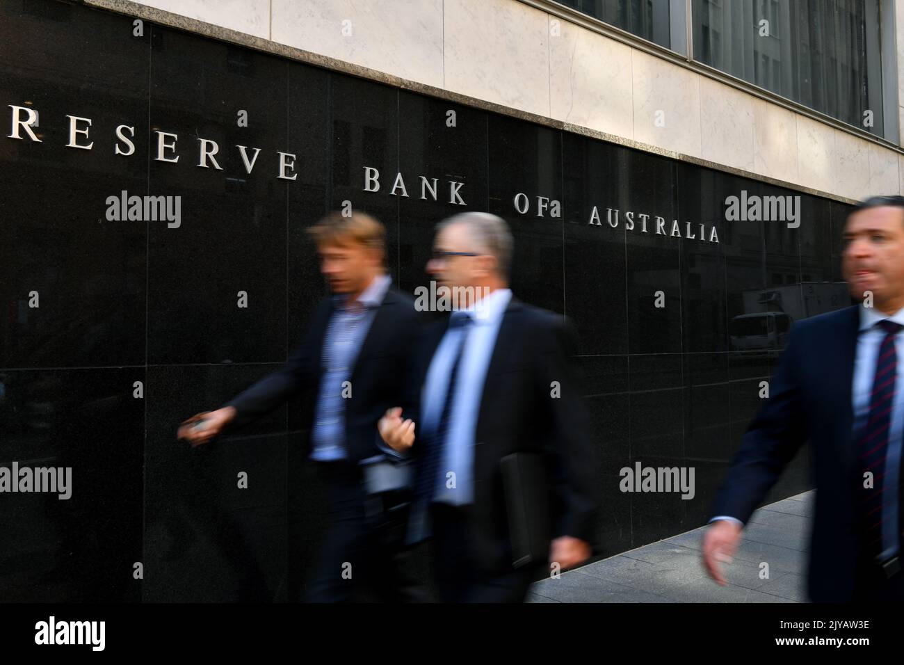 Pedestrians walk past the Reserve Bank of Australia (RBA) building in ...