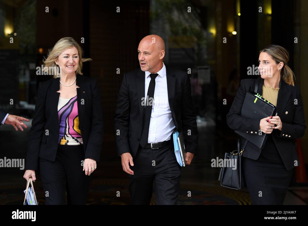 Gary Jubelin (centre) leaves Downing Centre Local Court in Sydney ...
