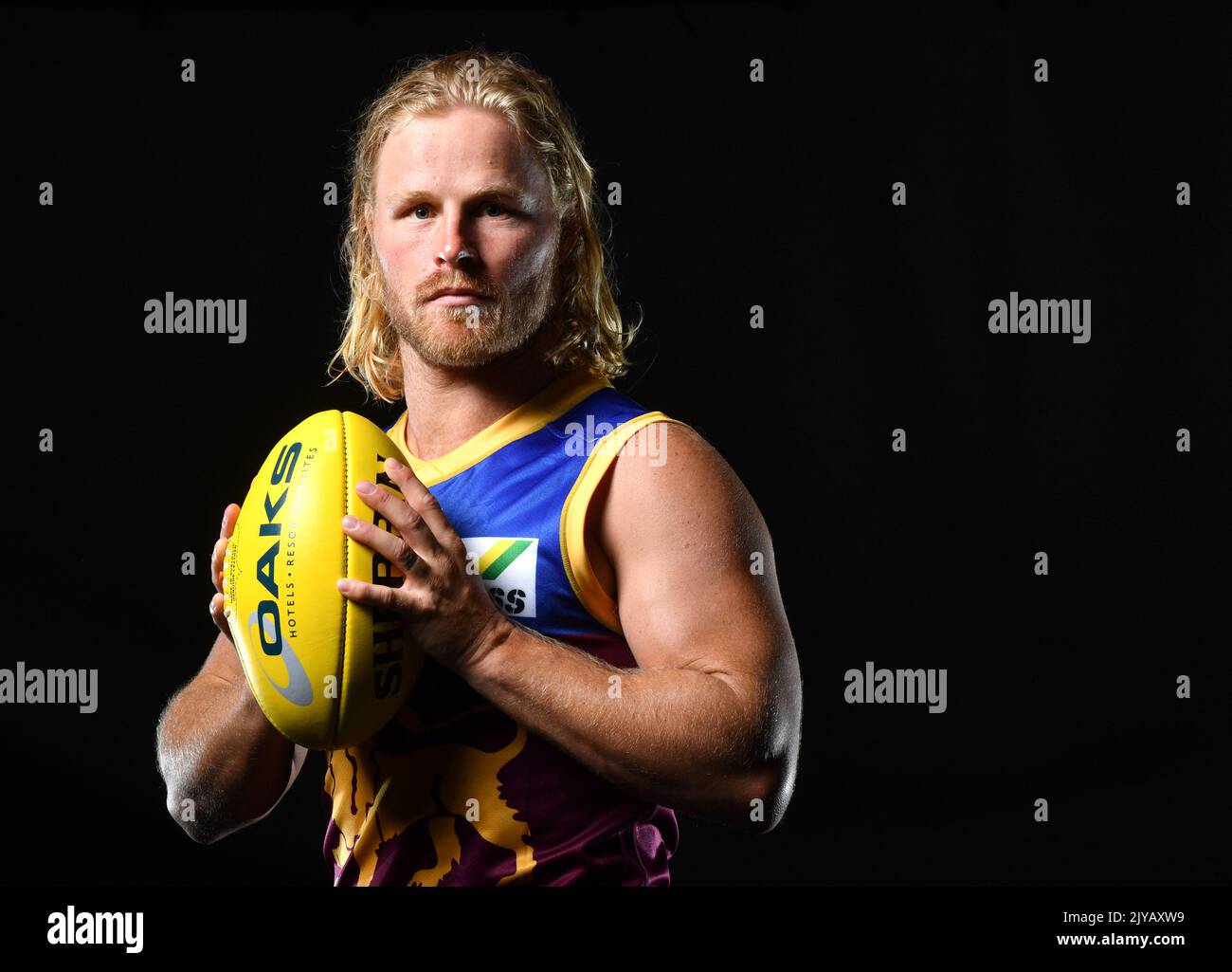 Daniel Rich of the Brisbane Lions is seen posing for a photograph ...