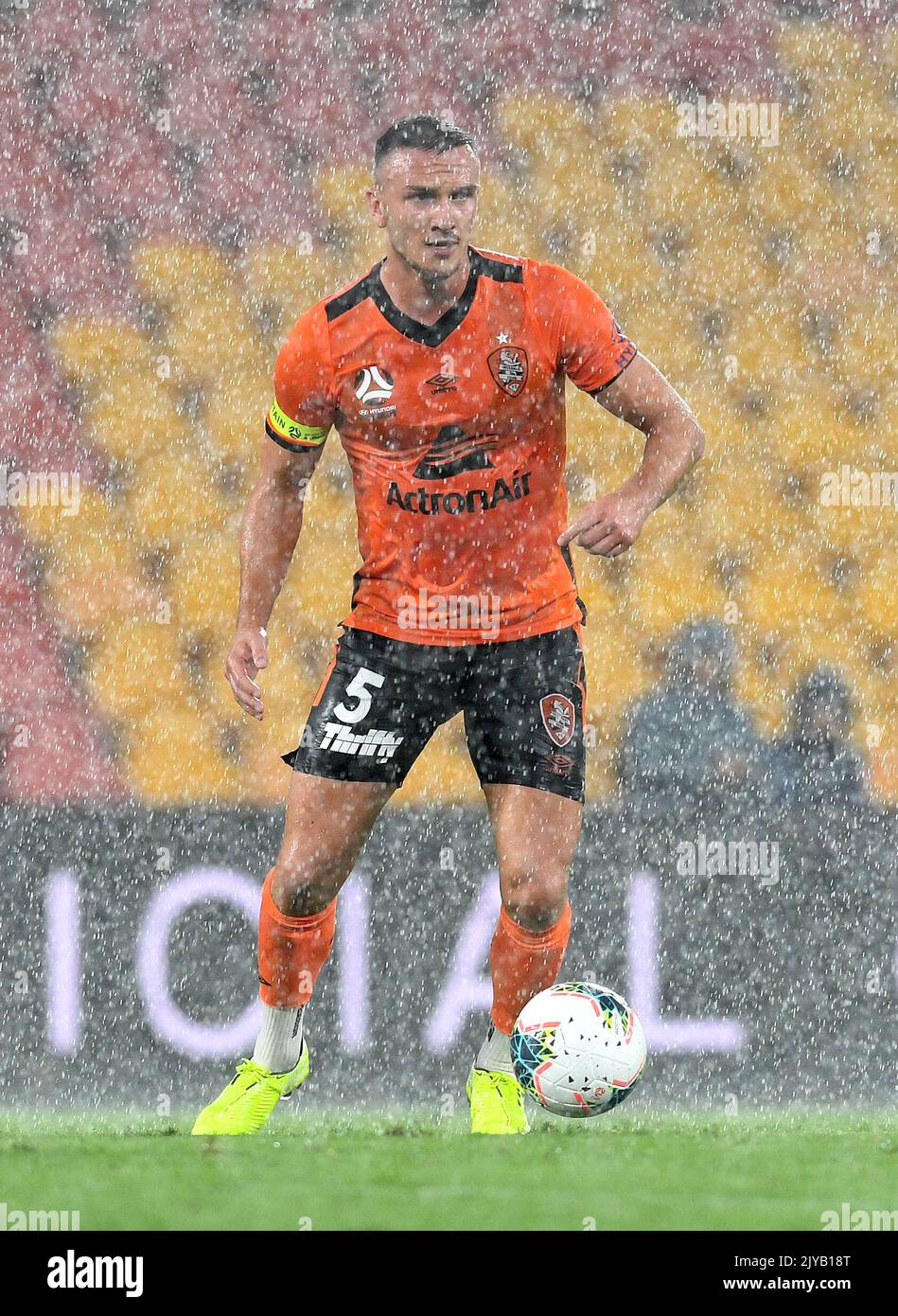 Roar captain Tom Aldred plays in heavy rain during the Round 18 A ...