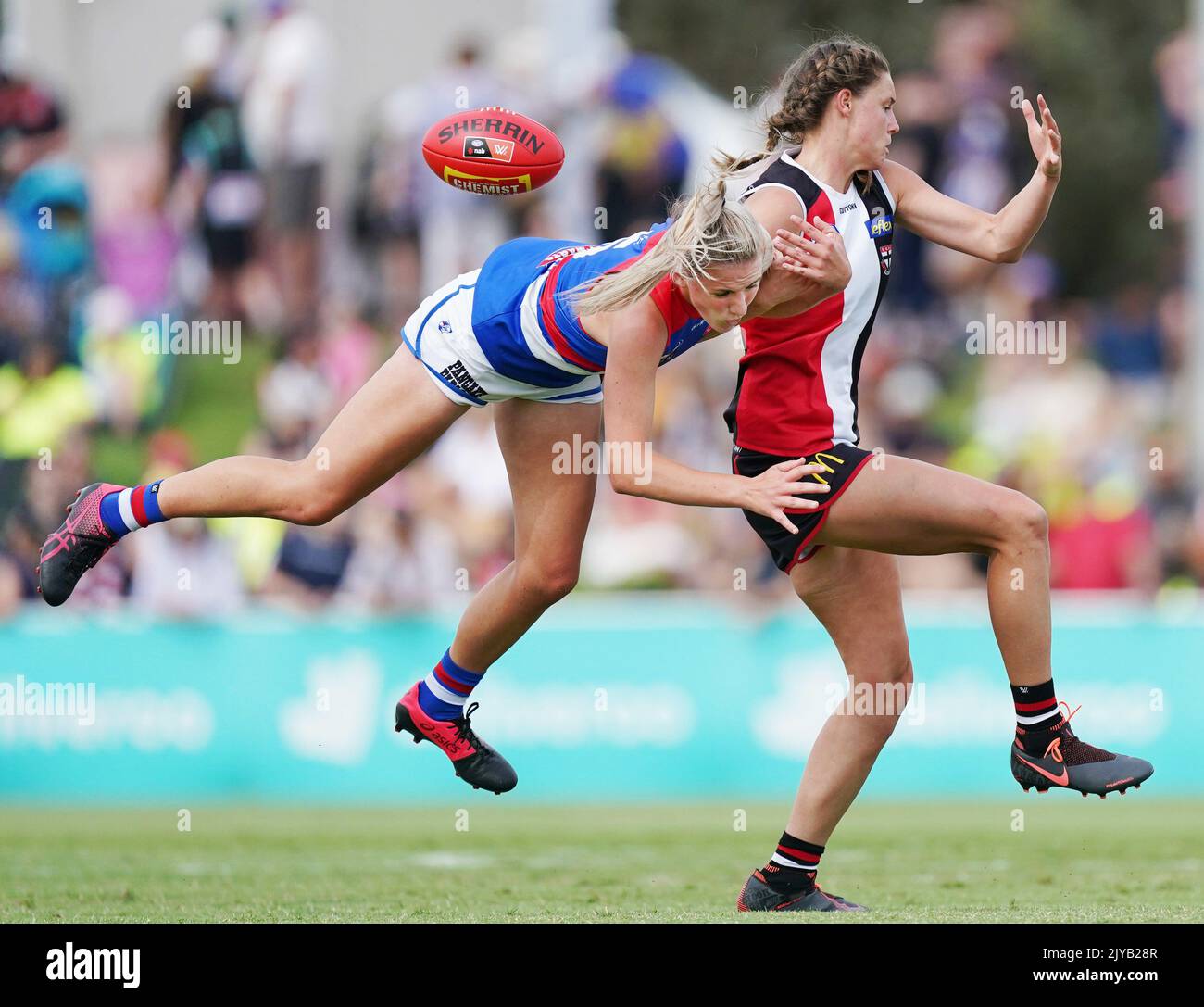 Nicola Xenos of the Saints collides into Gabby Newton of the Bulldogs ...