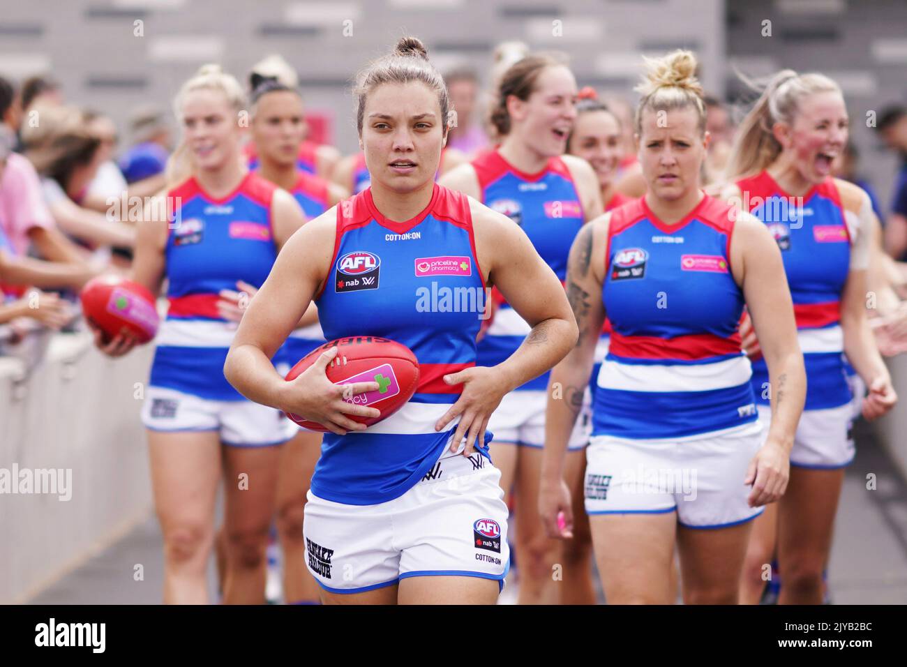 Ellie Blackburn of the Bulldogs leads the team out during the Round 1 ...