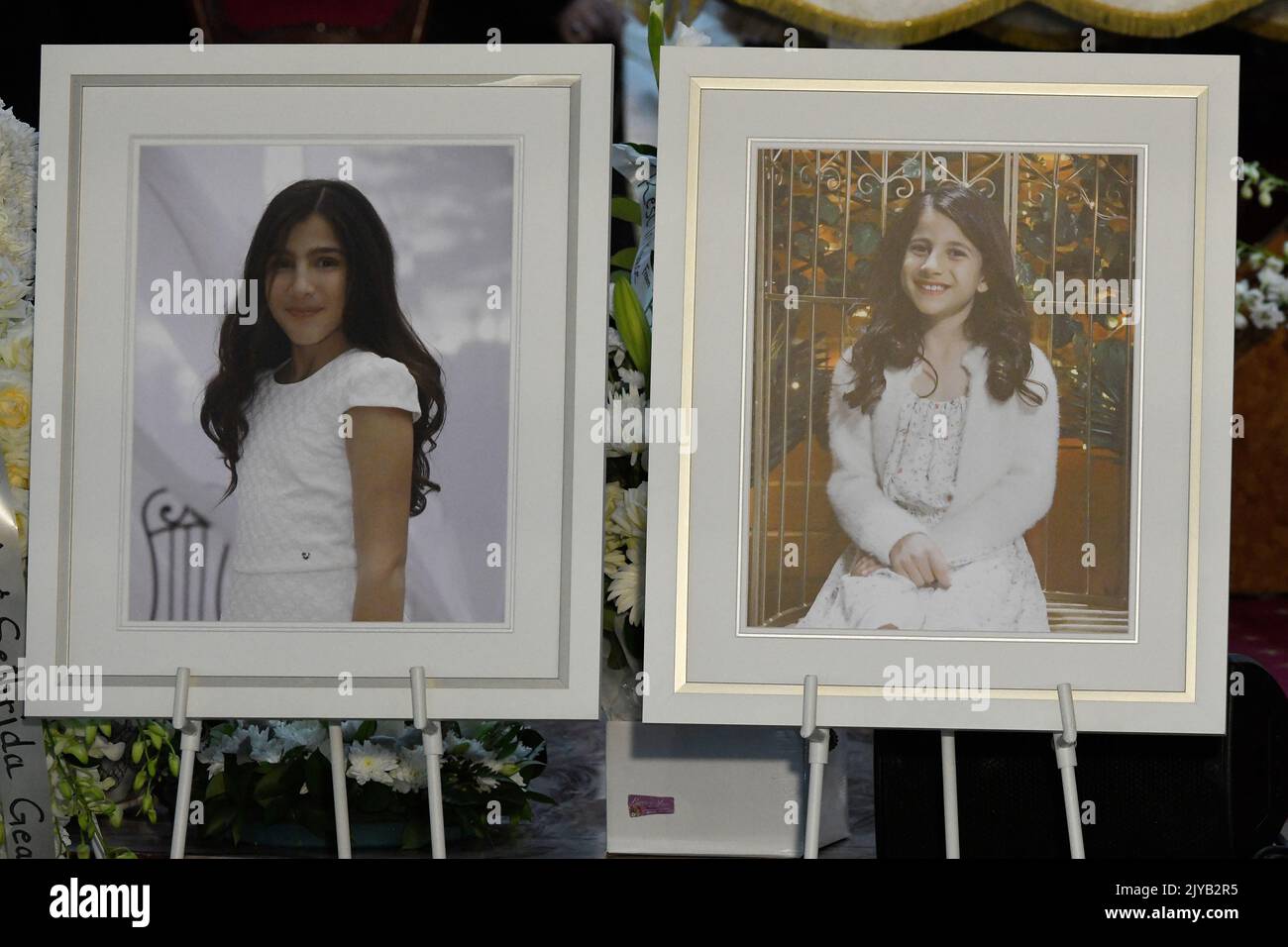 Photographs of Angelina (left) and Sienna are seen in the church during ...