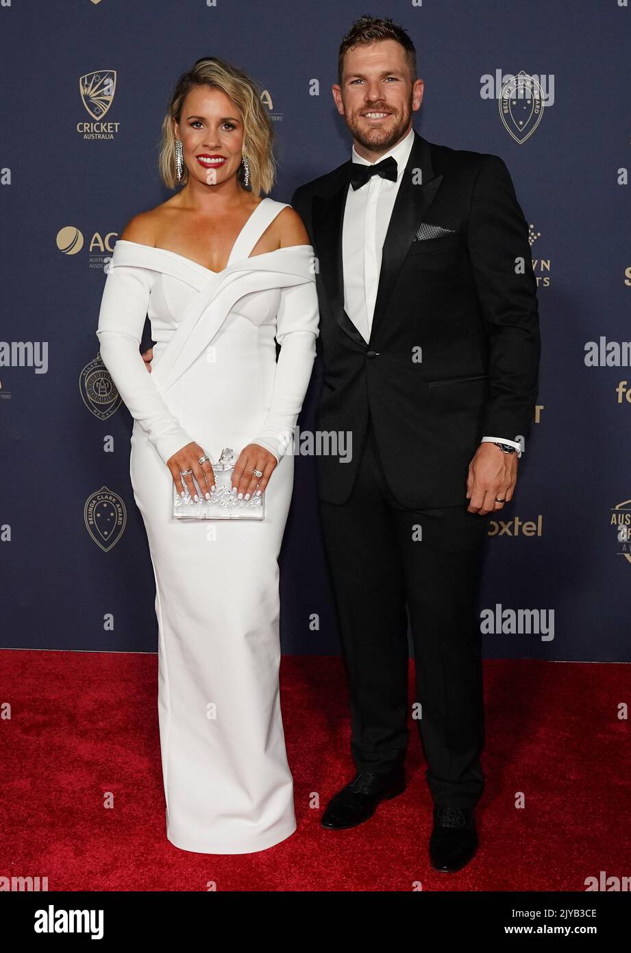 Aaron Finch (R) and wife Amy Finch arrive to attend the 2020 Australian ...