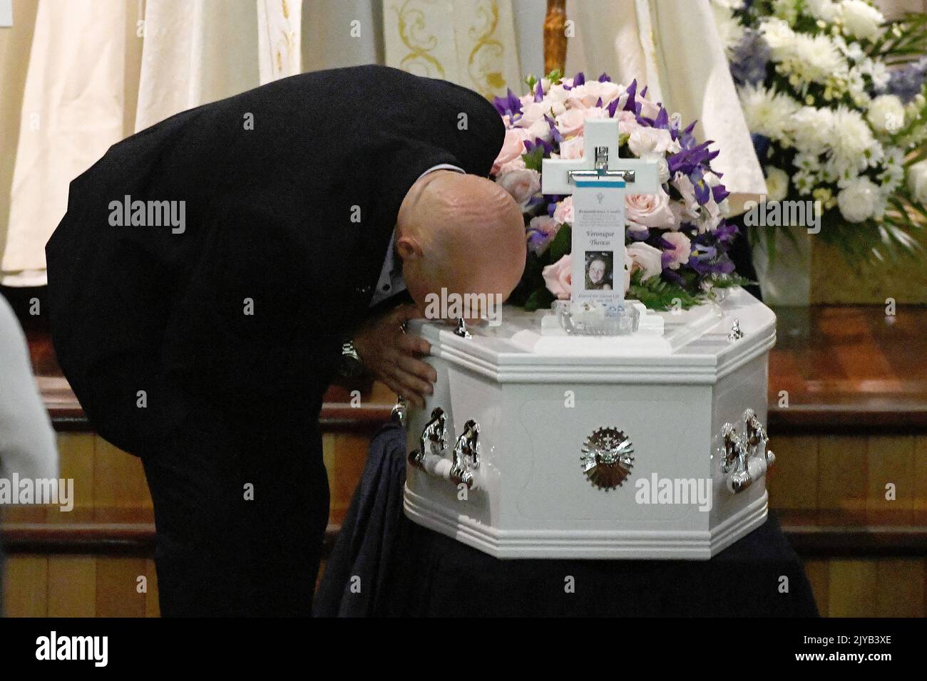 Bob Sakr kisses the coffin of his daughter Veronique Sakr, 11, during ...