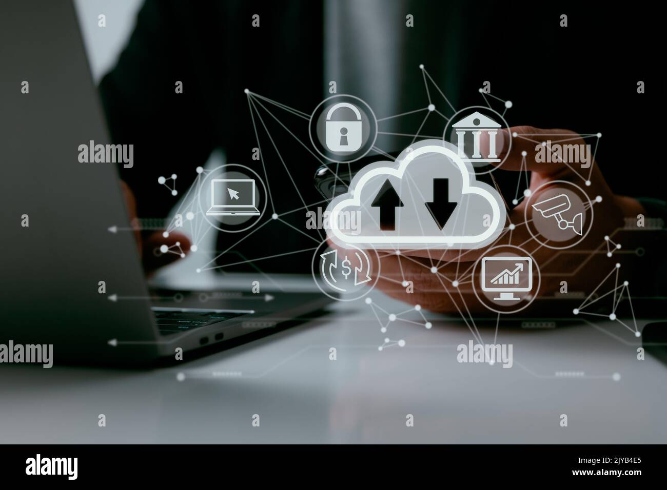 A guy uses a laptop with a cloud computing graphic. Cloud computing data storage networking and ...