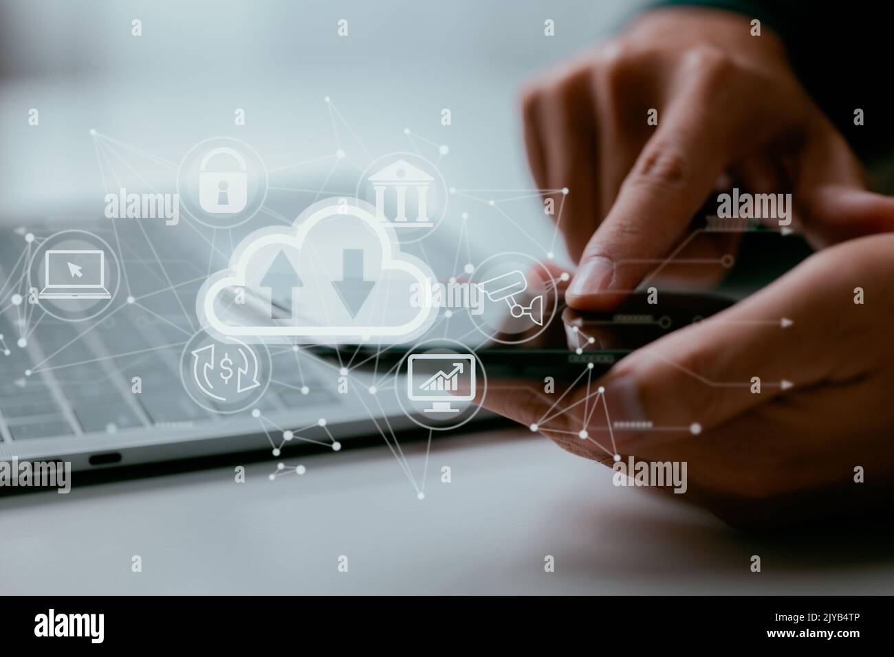 A guy works on a laptop with a cloud computing diagram. Cloud computing and internet service ...