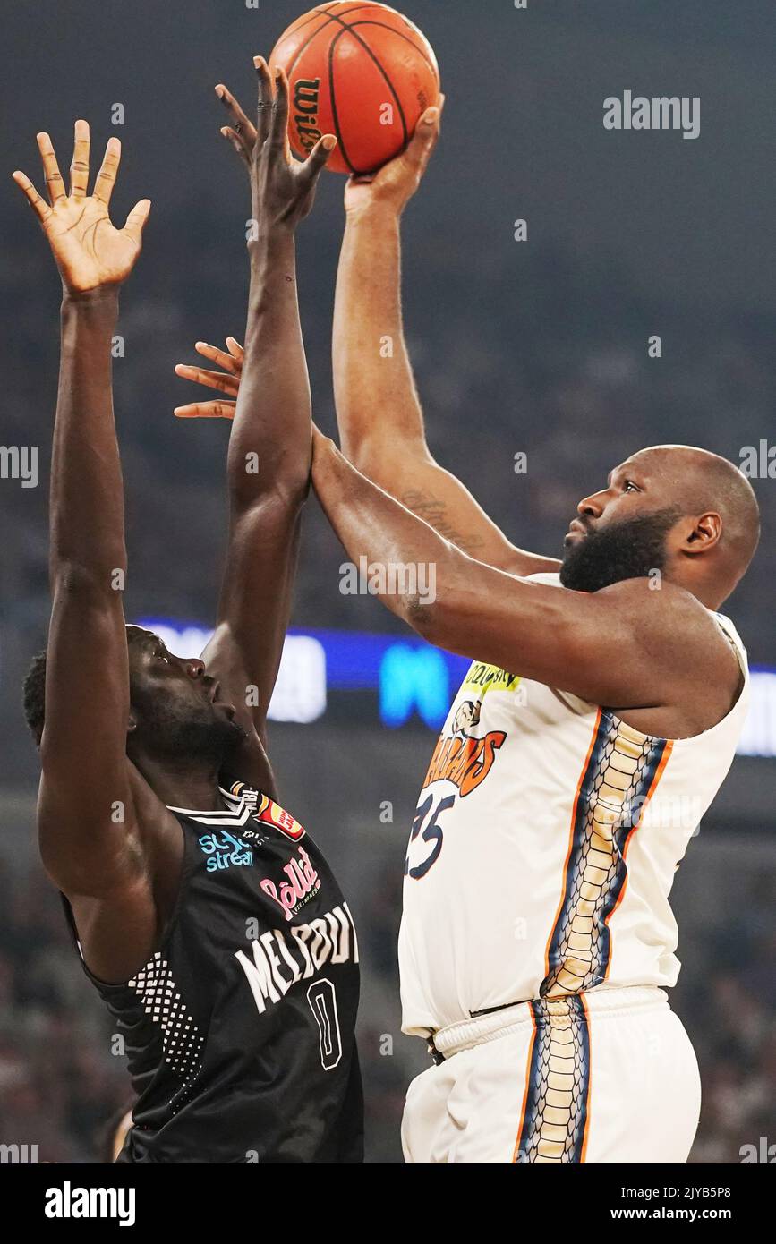 Nathan Jawai of the Taipans shoots the ball past Jo Lual Acuil of ...