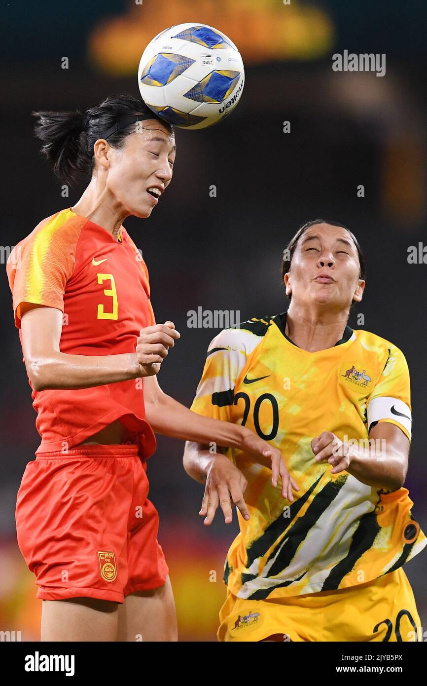Lin Yuping of China beats Sam Kerr of Australia to a header during the ...