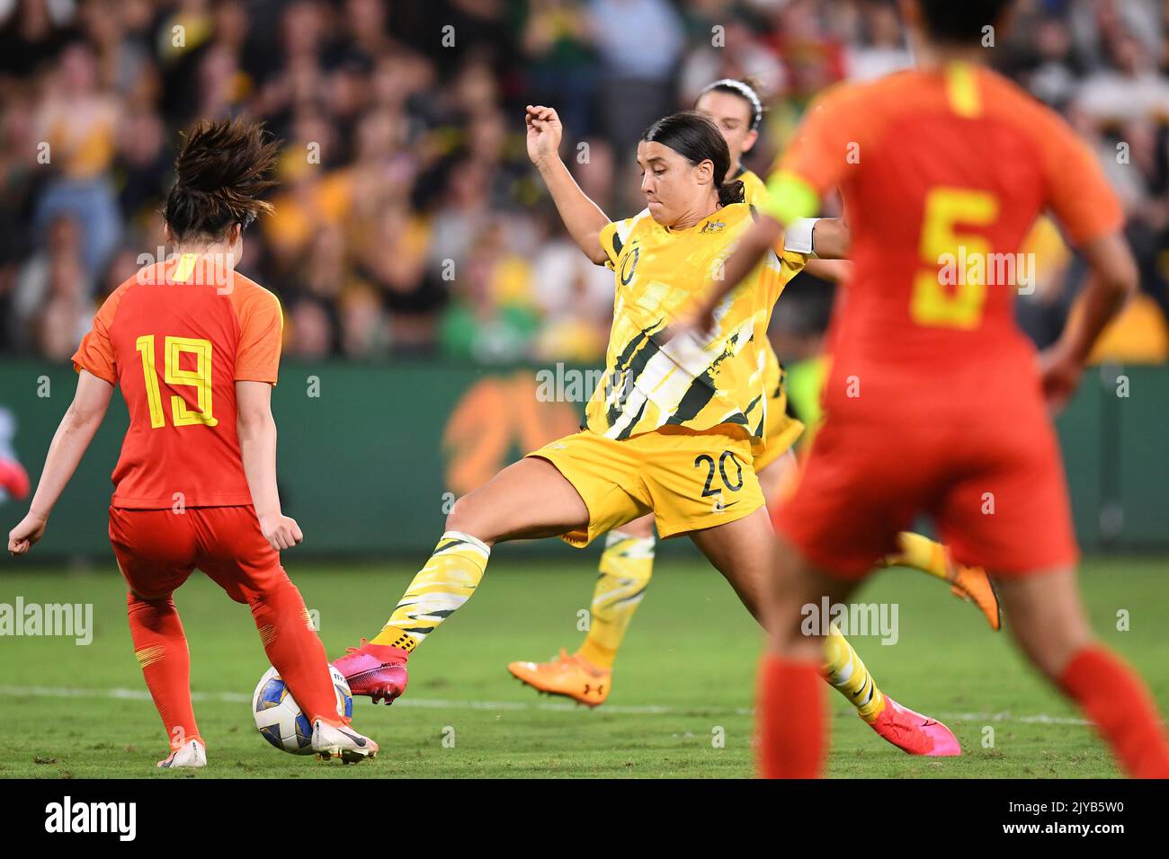 Sam Kerr of Australia comes under pressure from Zhai Qingwei of China ...