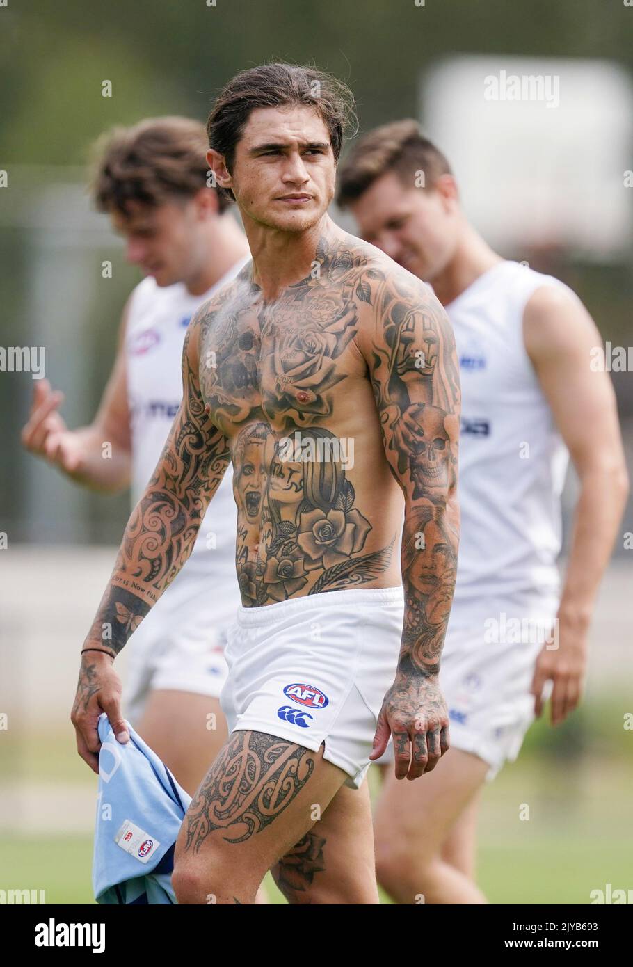 Marley Williams of the Kangaroos is seen with his top off during a ...