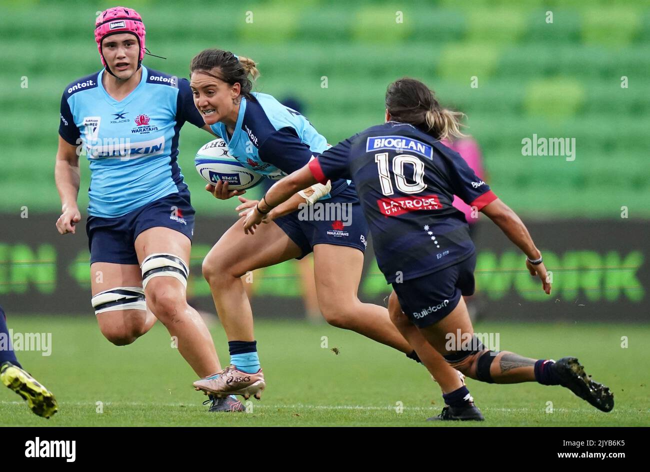Katrina Barker of the Waratahs runs with the ball during the Round 1 ...