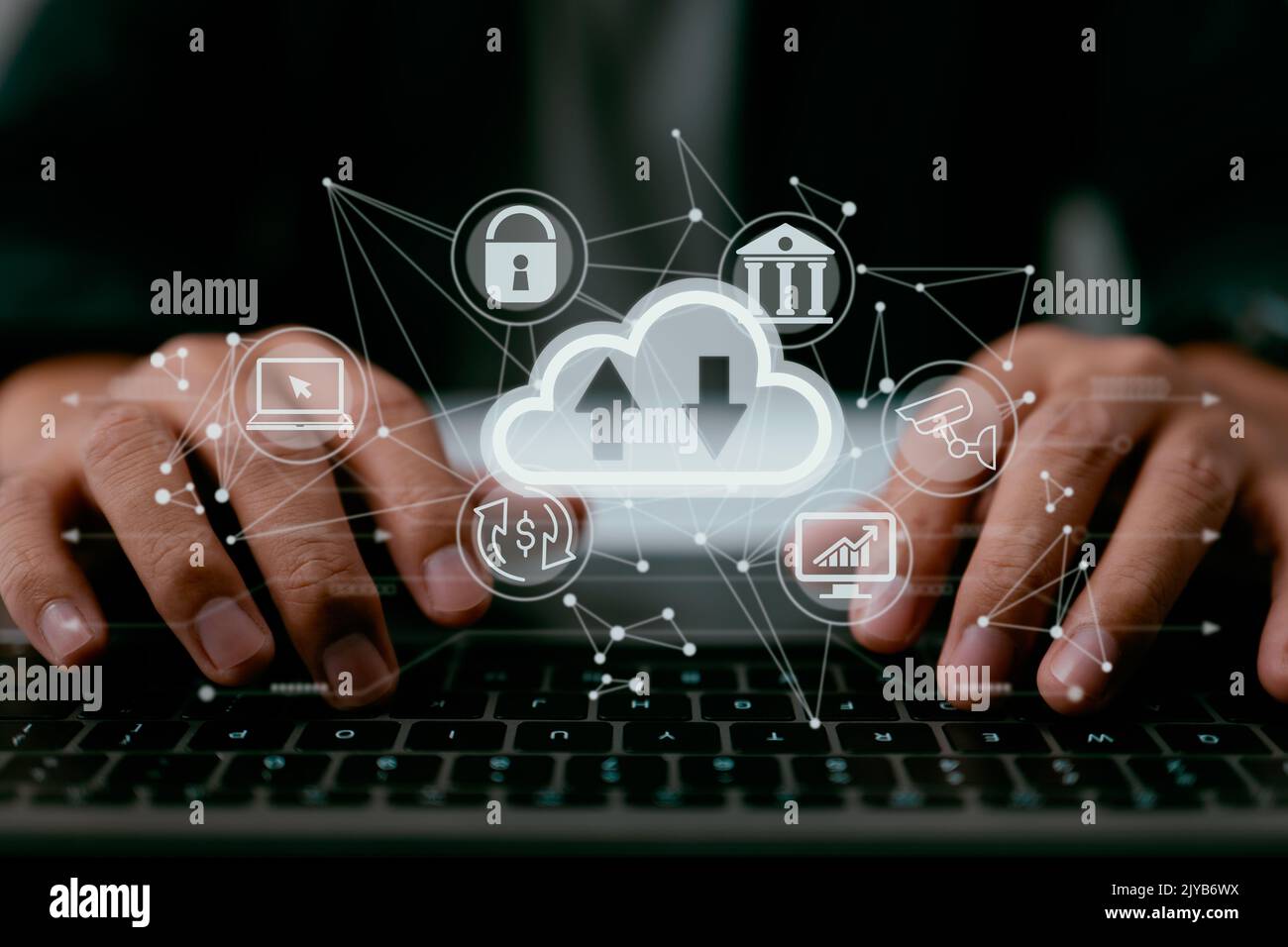 A man uses a laptop that displays a schematic of cloud computing. Data storage, networking, and ...