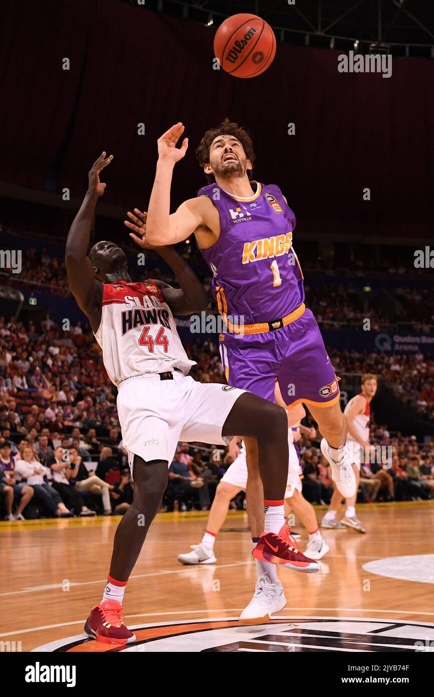 Jordan Hunter of the Kings and Sunday Dech of the Hawks during the ...