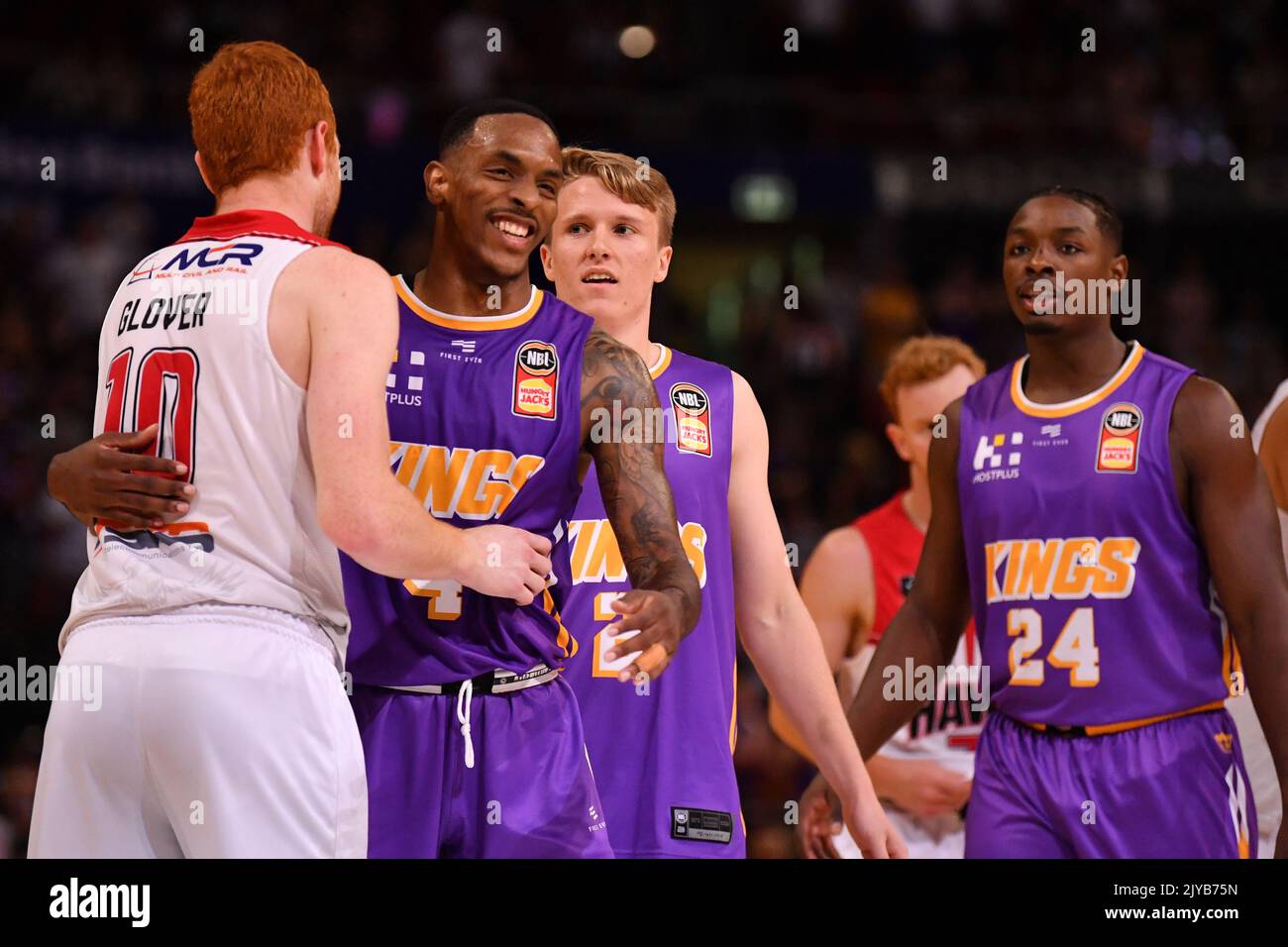 Deshon Taylor of the Kings congratulates Angus Glover of the Hawks ...