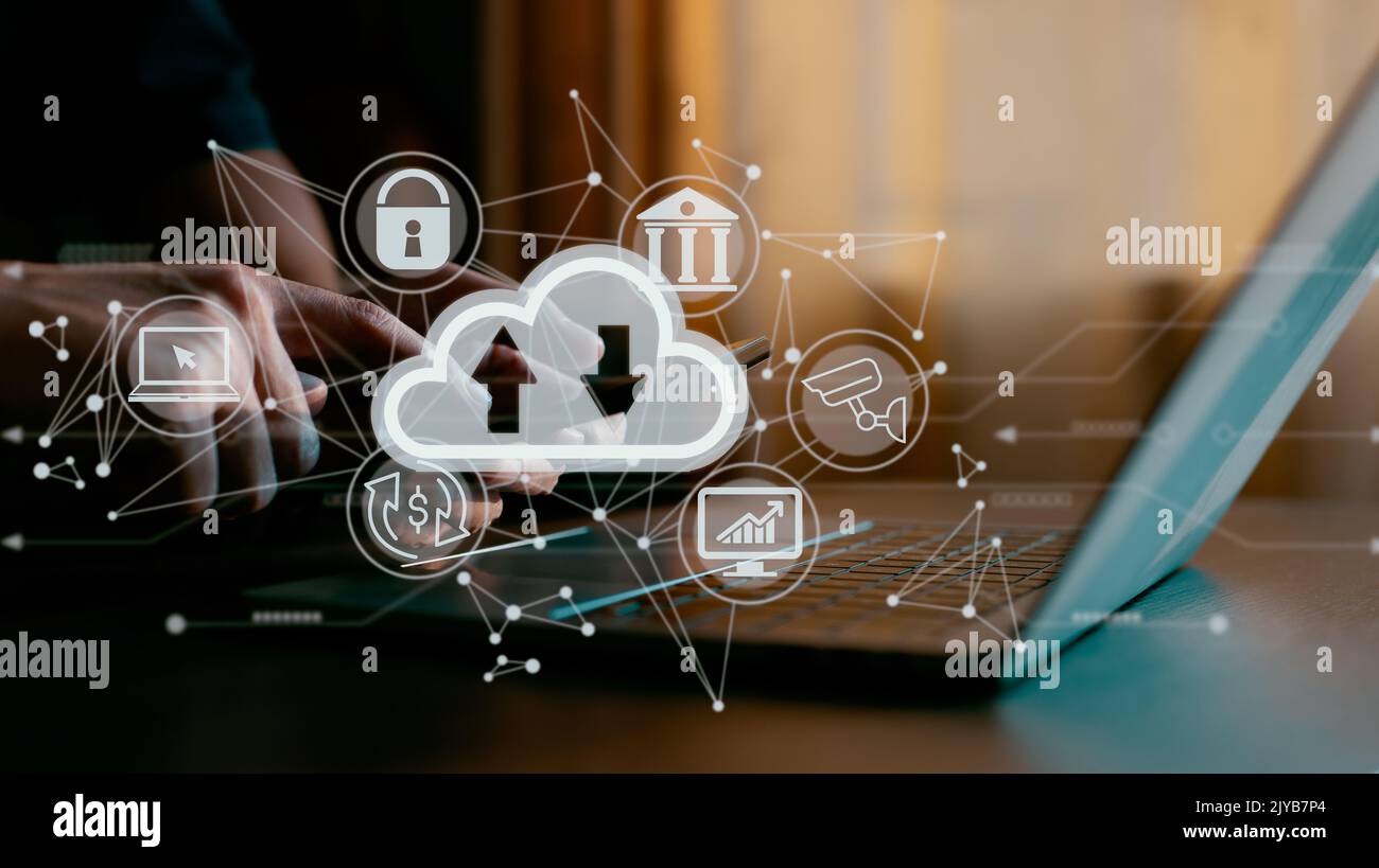 A Guy Works On A Laptop While Holding A Cloud Computing Diagram Concepts Of Cloud Computing
