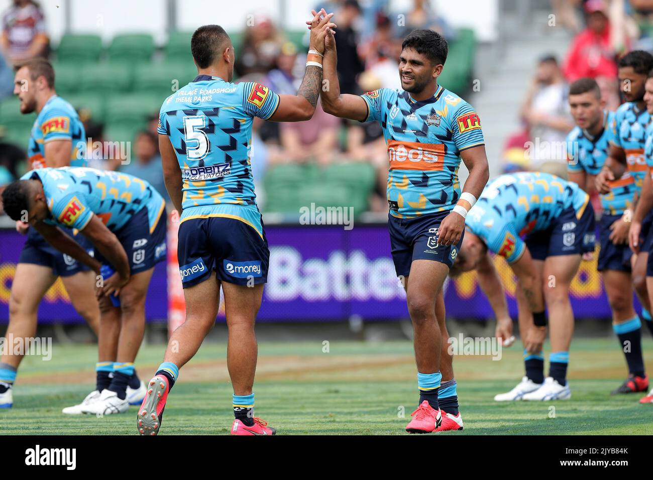 Phil Sami (left) and Tyrone Peachey of the Titans celebrate winning ...